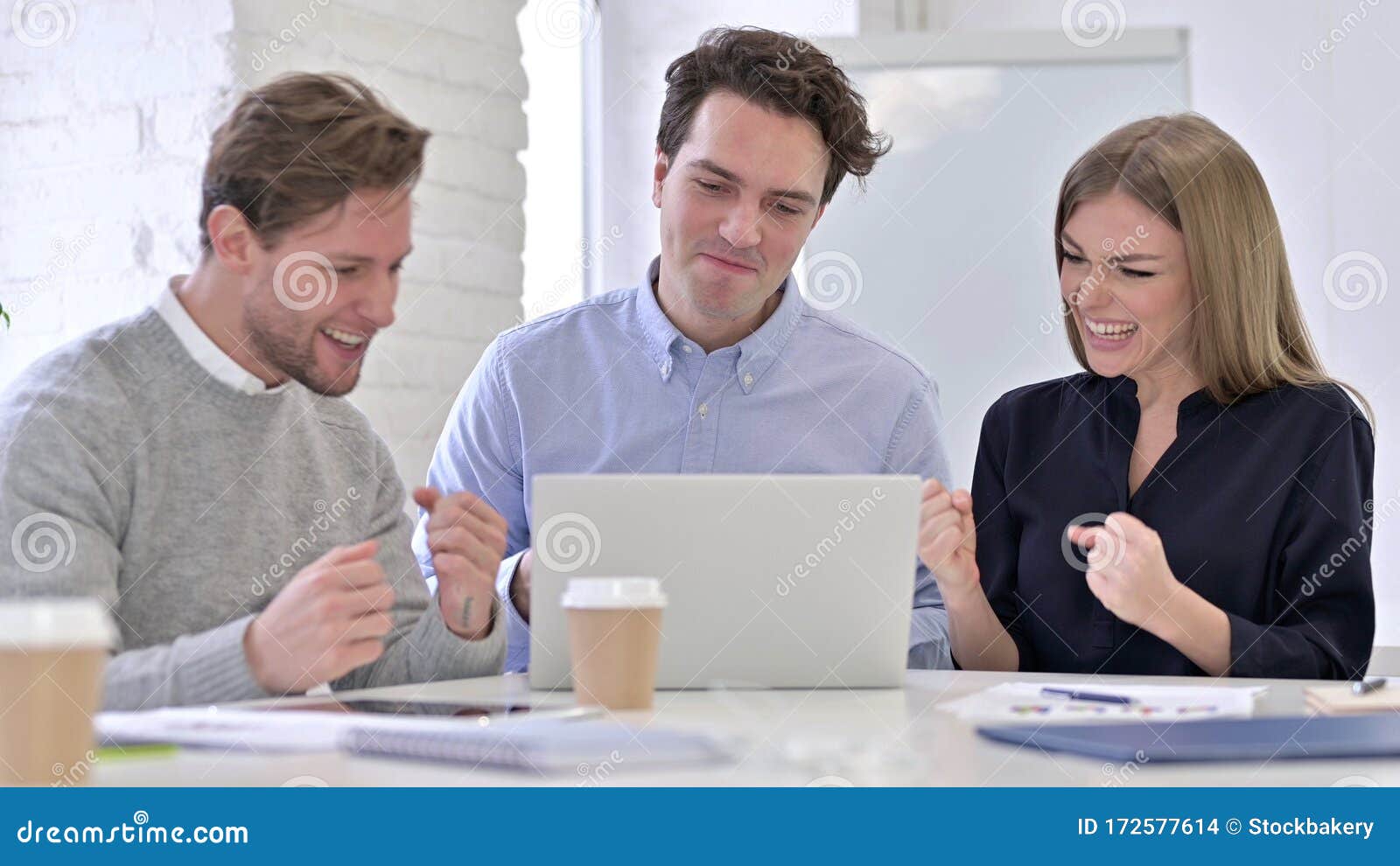 The Excited Team Celebrating Success in Modern Office Stock Photo ...