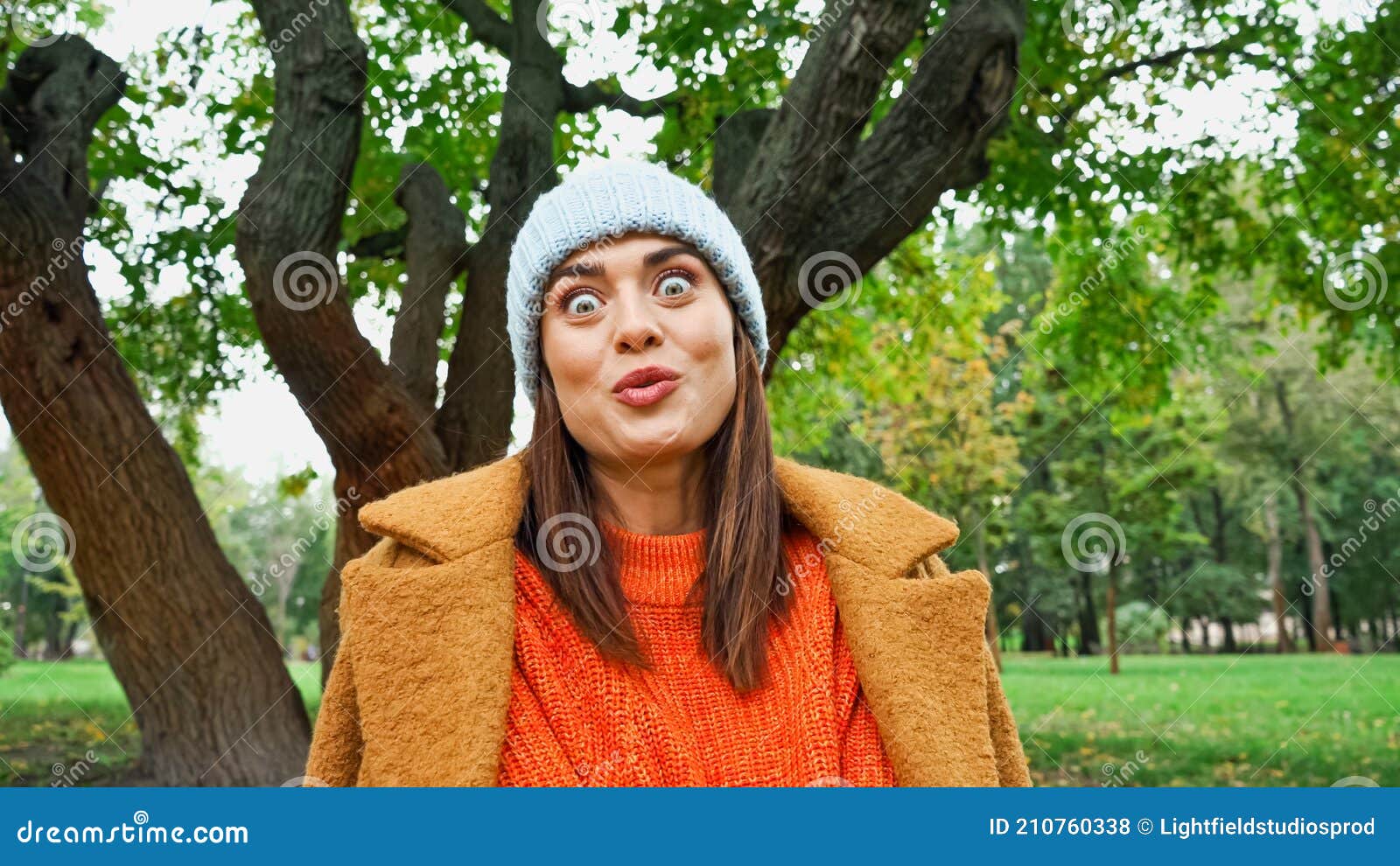 Excited Woman with Crazy Face Expression Looking at Camera in Park ...