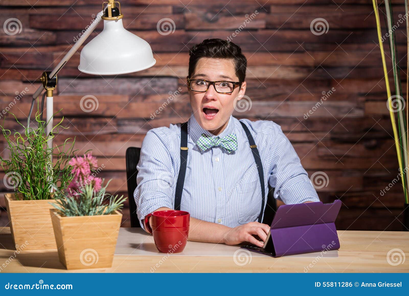 Excited Woman at Desk with Tablet Stock Photo - Image of lamp ...