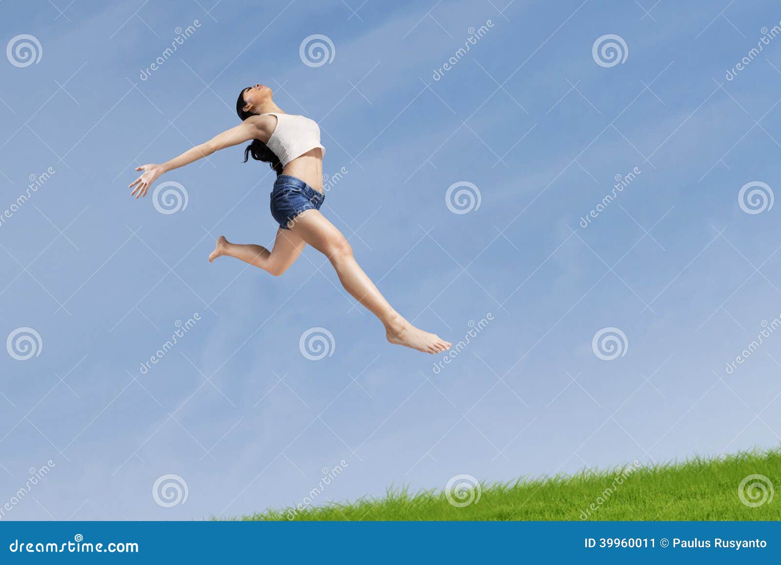 Excited Woman Jumping Highly Stock Image - Image of hispanic, grass ...