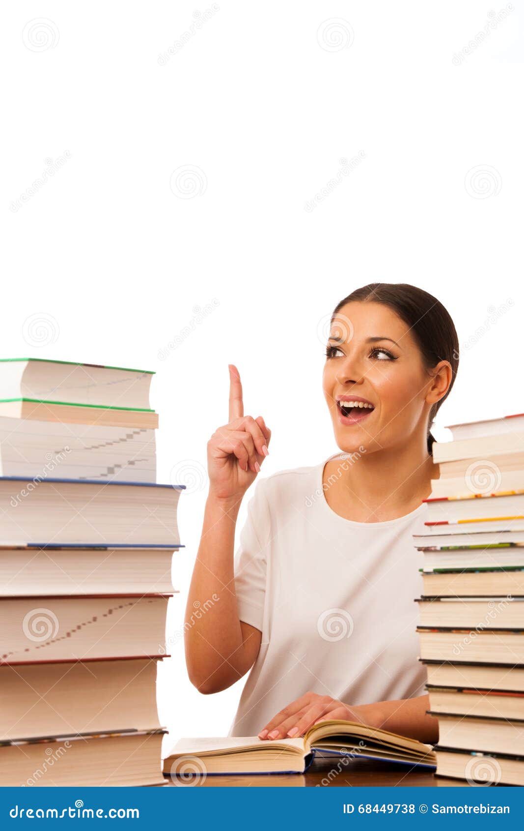 Excited Woman Reading Behind the Table between Two Pile of Books Stock ...