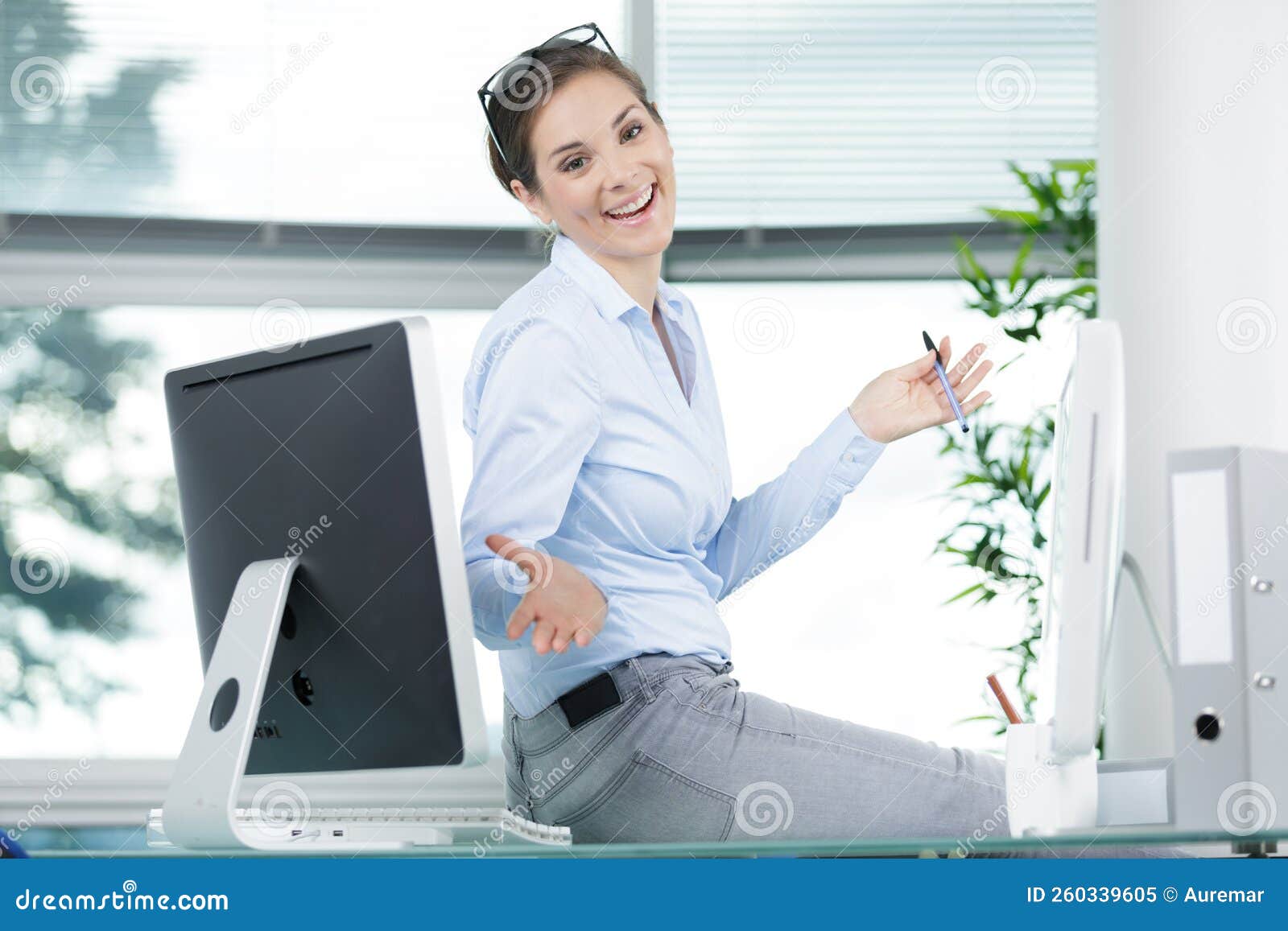 Excited Woman Working at Desk in Office Stock Image - Image of working ...