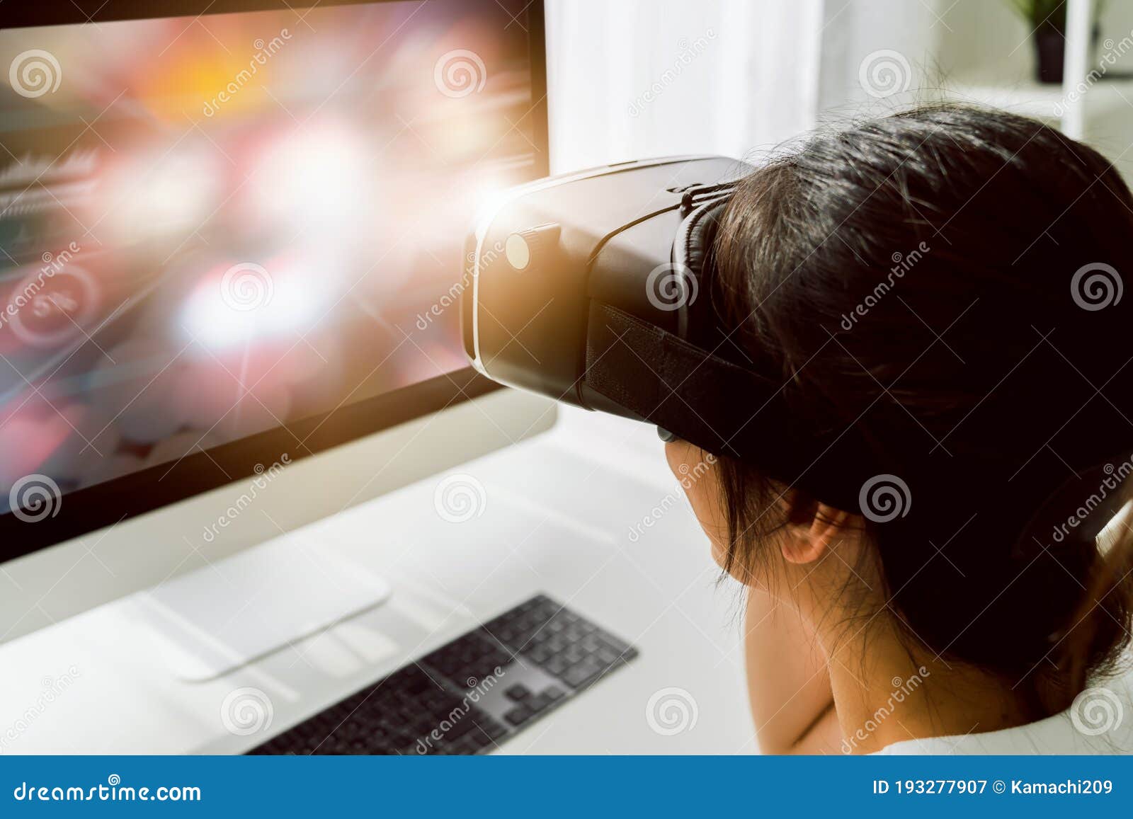 Excited Young Asian Woman Using a Virtual Reality Headset and Joysticks ...