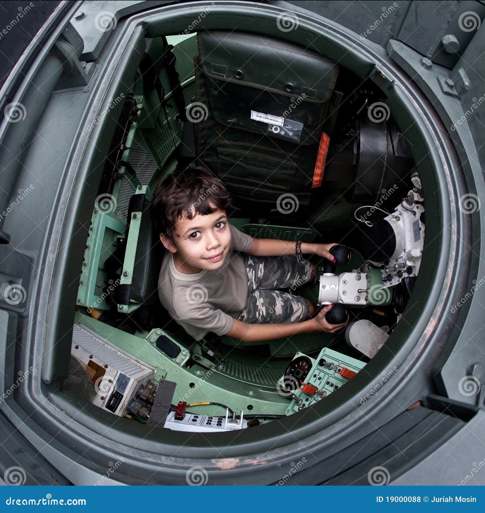 Excited Young Boy Sitting in a Tank Stock Photo - Image of excitement ...