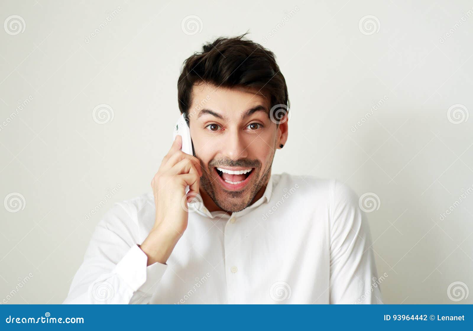 Excited young man calling stock photo. Image of attractive - 93964442
