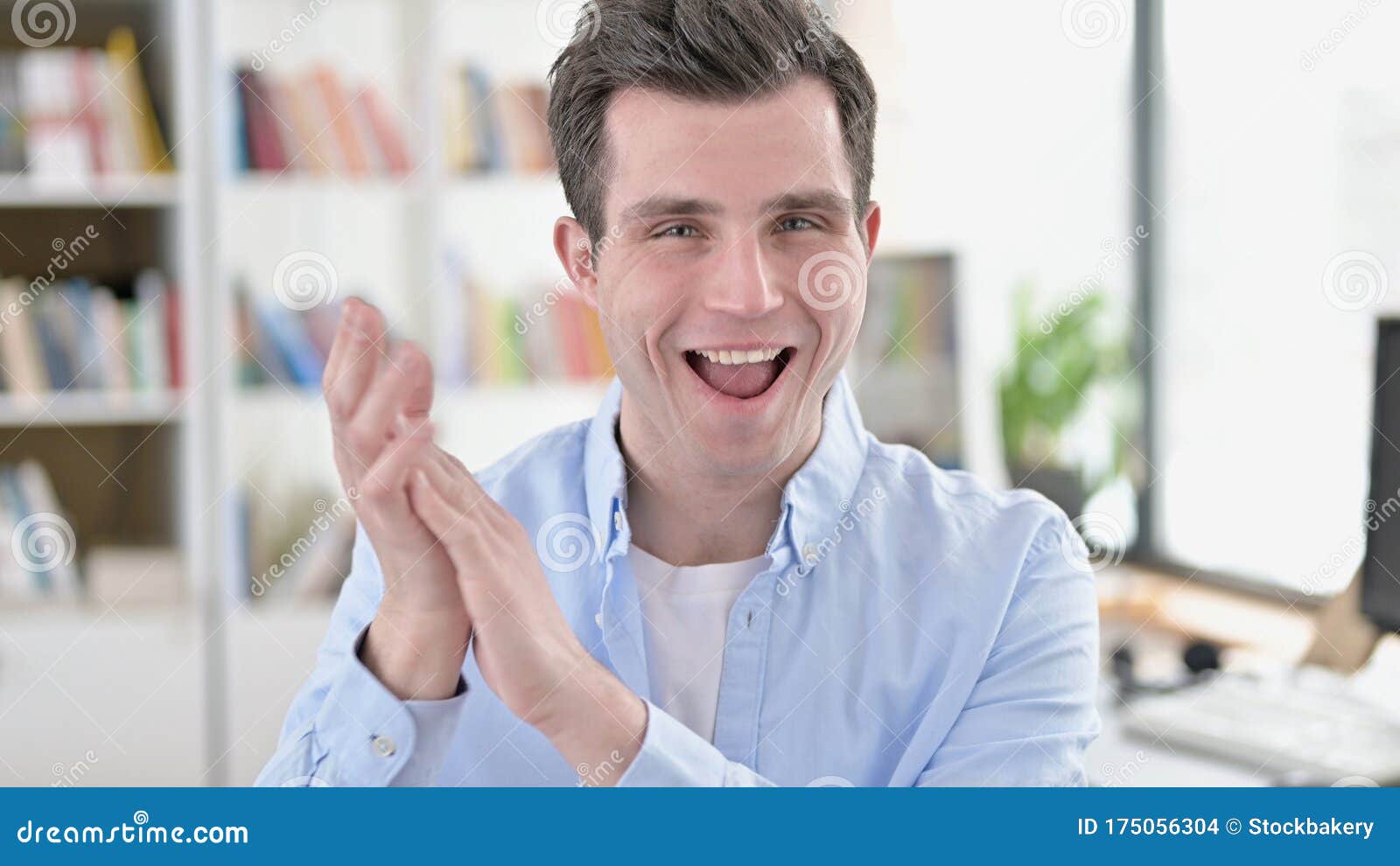 Excited Young Man Clapping for Team Stock Photo - Image of clapping ...