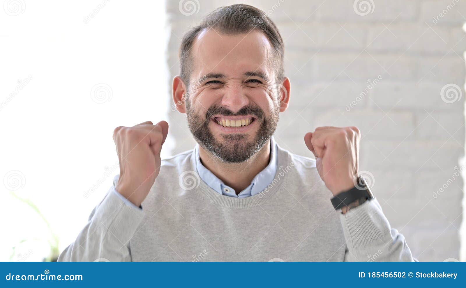 Excited Young Man Engineer Celebrating Success Stock Photo - Image of ...