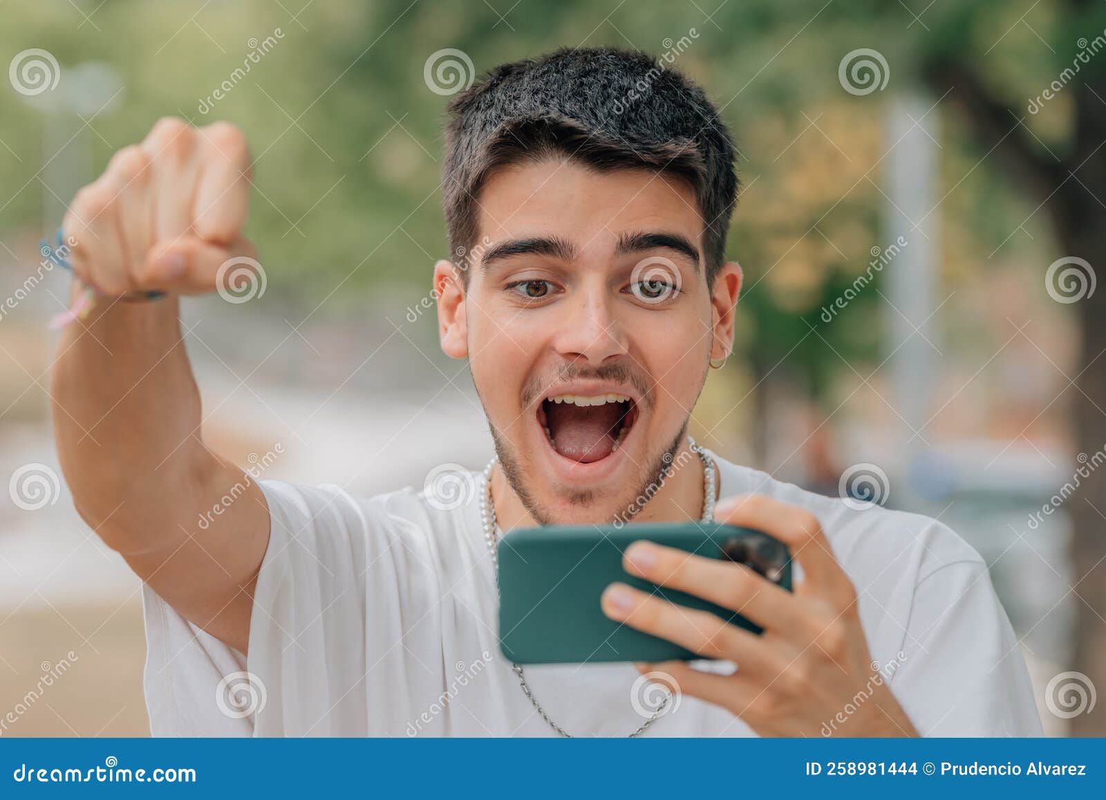 Man Playing or Looking at Mobile Phone Stock Photo - Image of gam22icb ...
