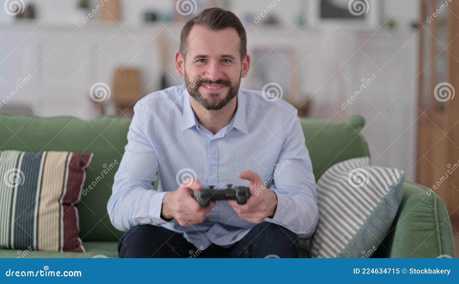 Excited Young Man Playing and Winning Video Game Stock Image - Image of ...