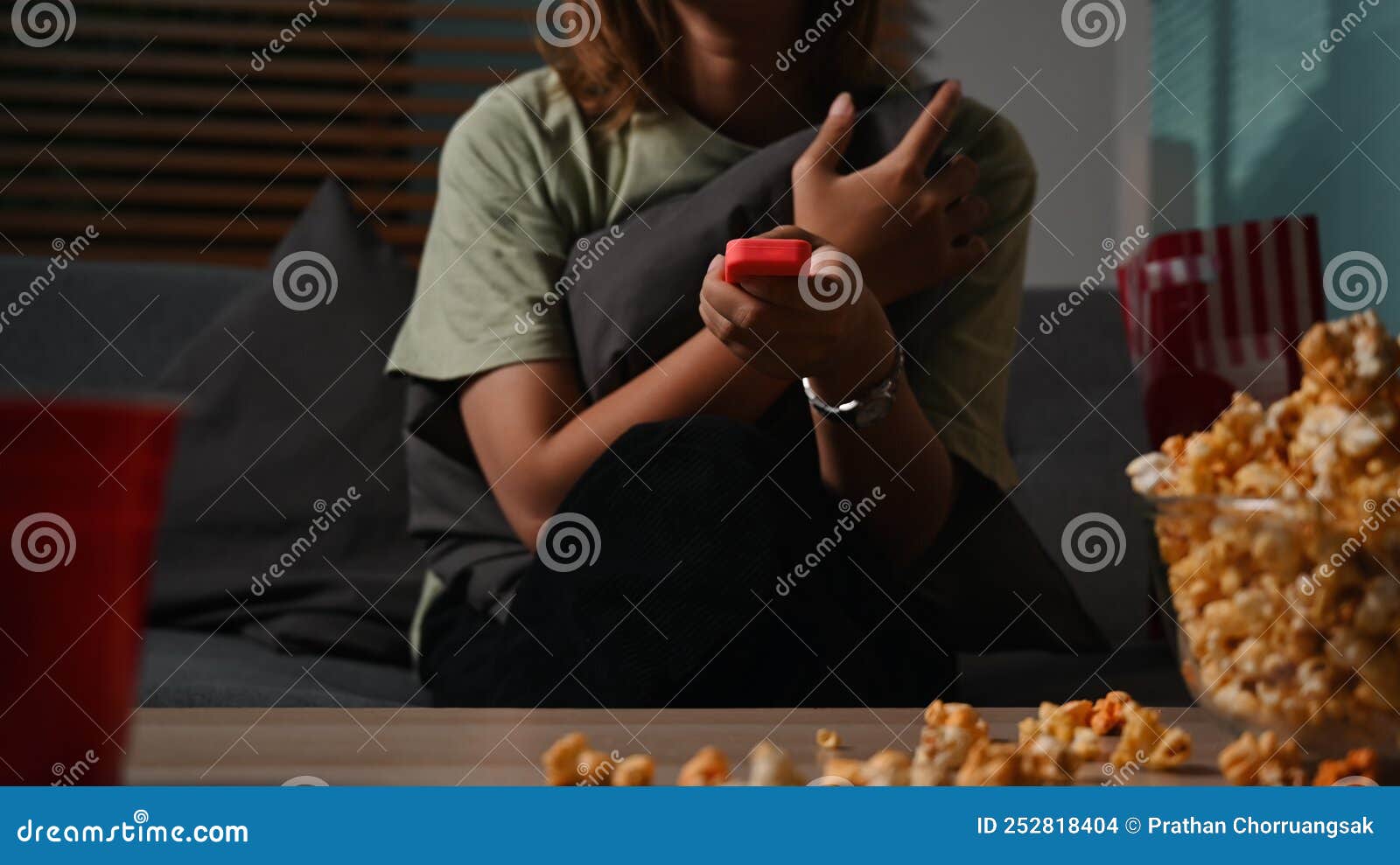 Excited Young Woman Eating Popcorn While Enjoying In Movie Night At