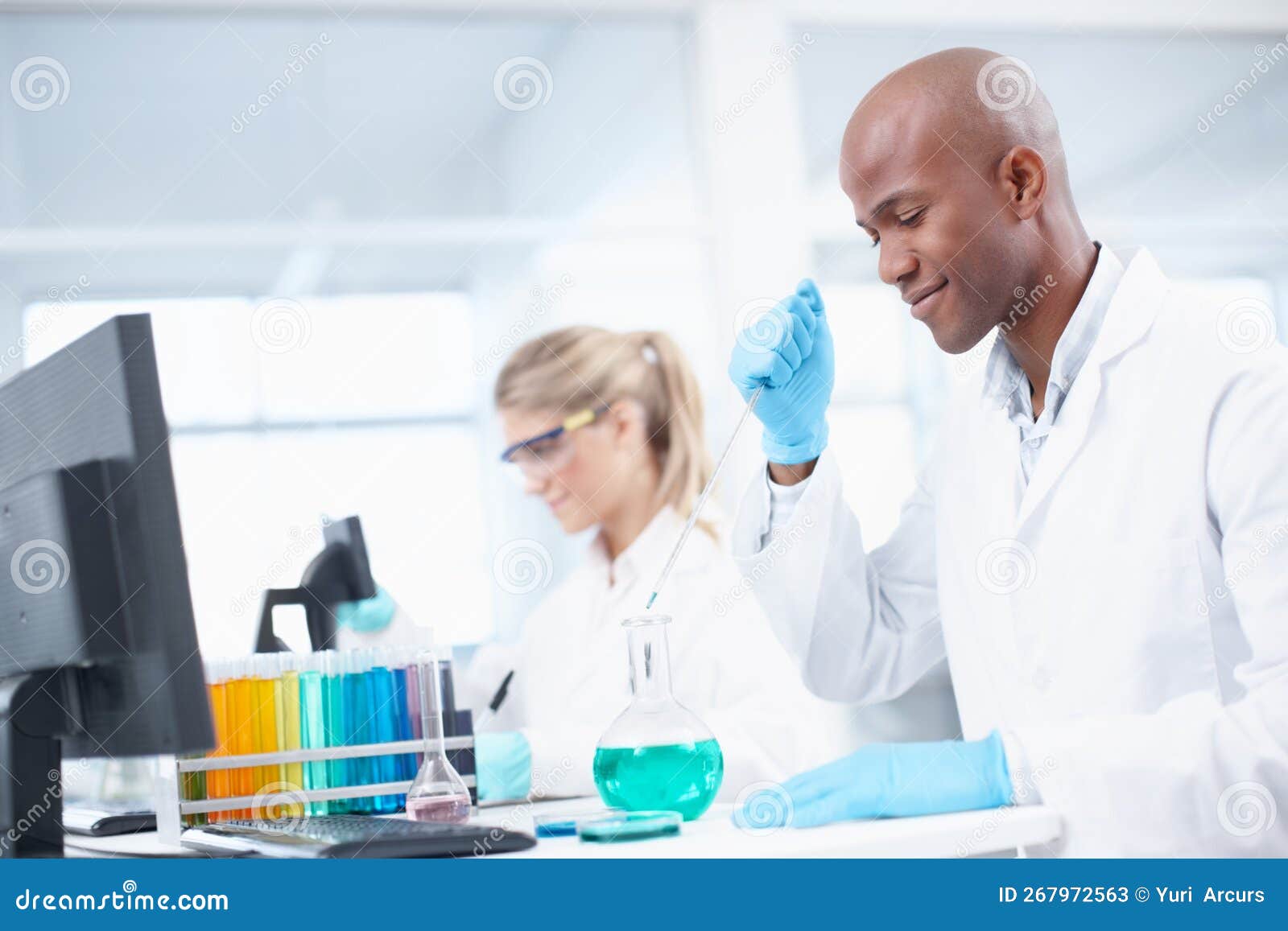 An Exciting Experiment. a Team of Scientists Working in the Laboratory ...