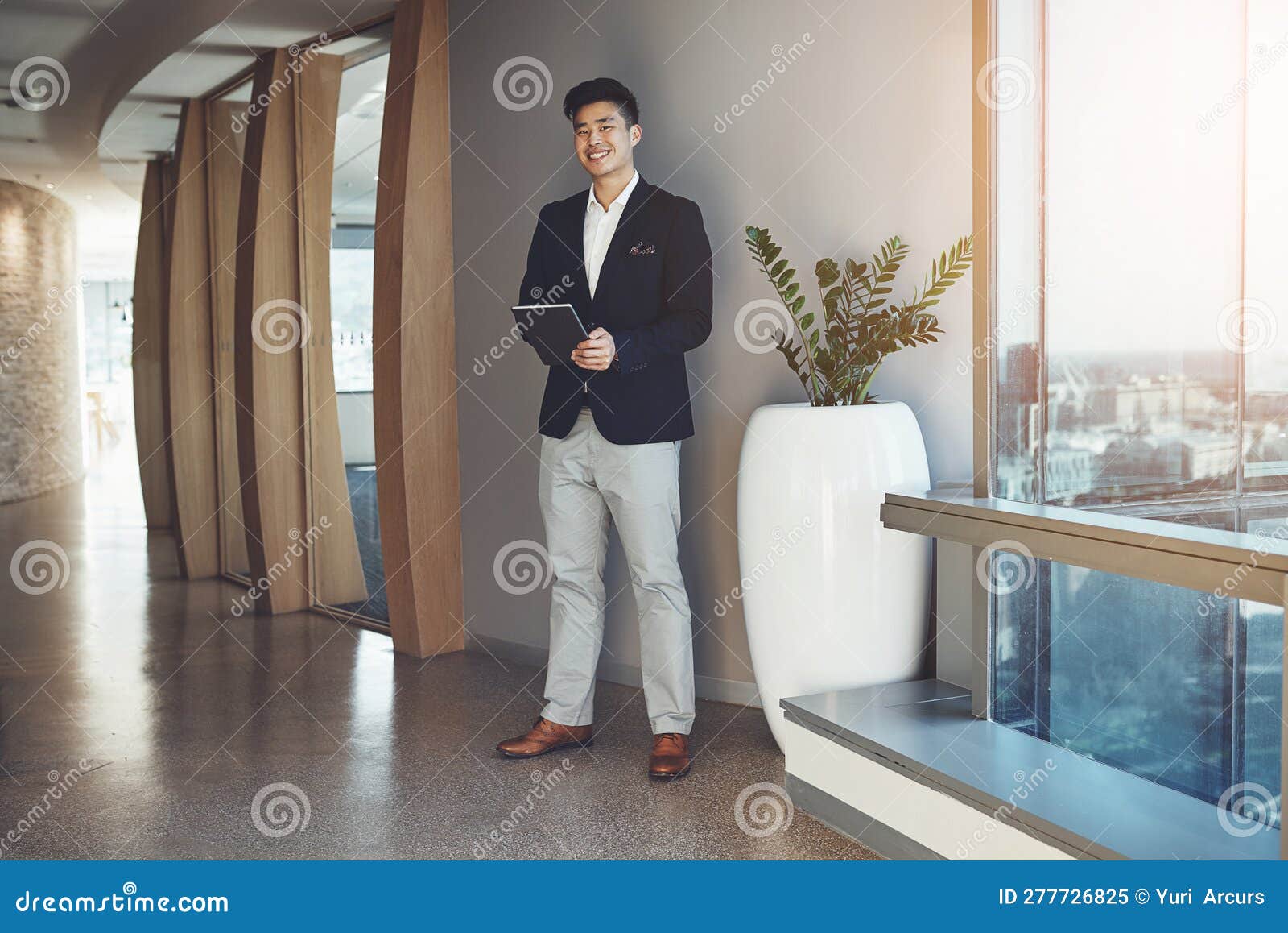 Executing Business with the Smartest of Apps. Portrait of a Young ...