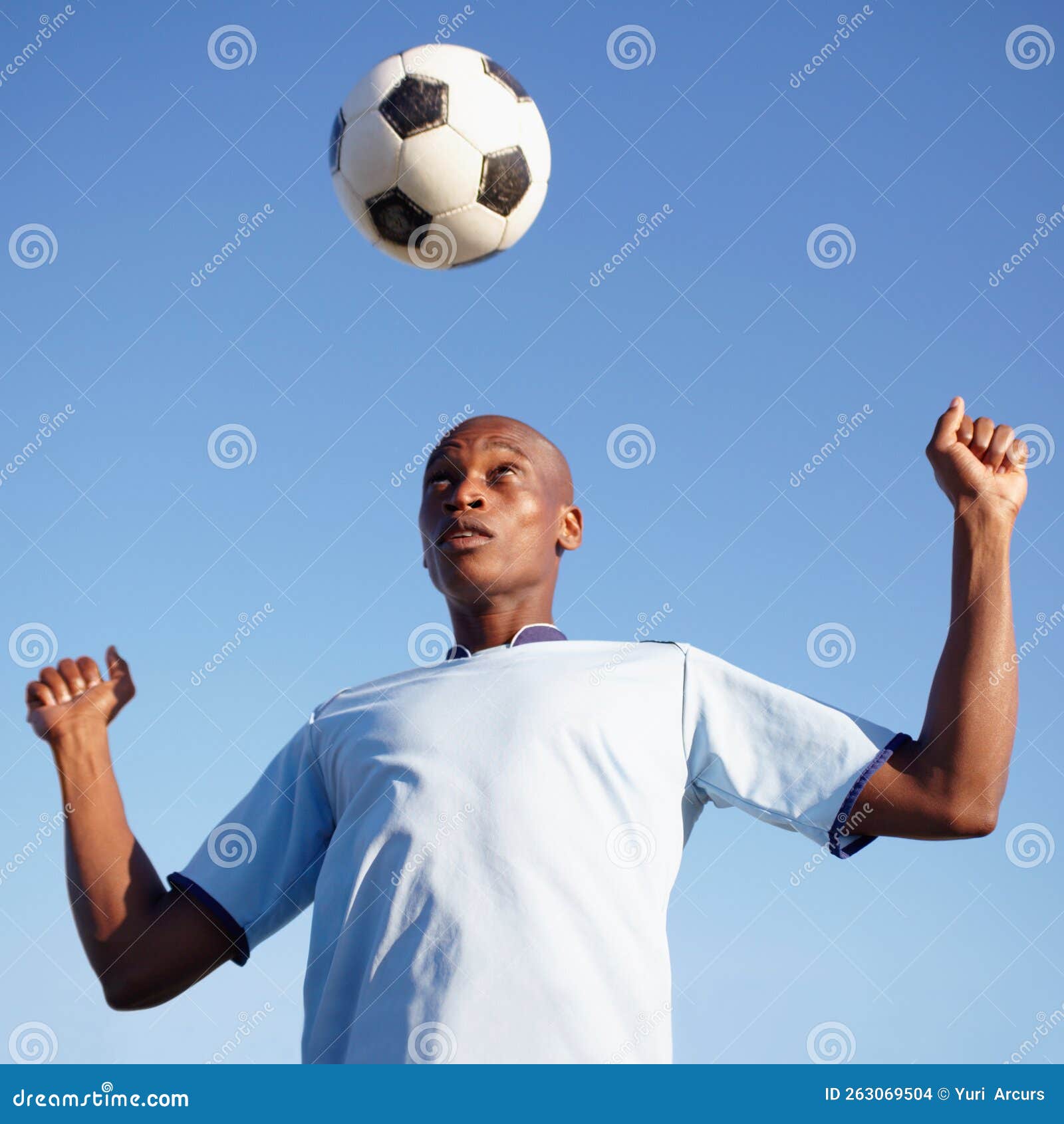 Executing a Perfect Defensive Header. a Young Man Going Up for a Header ...