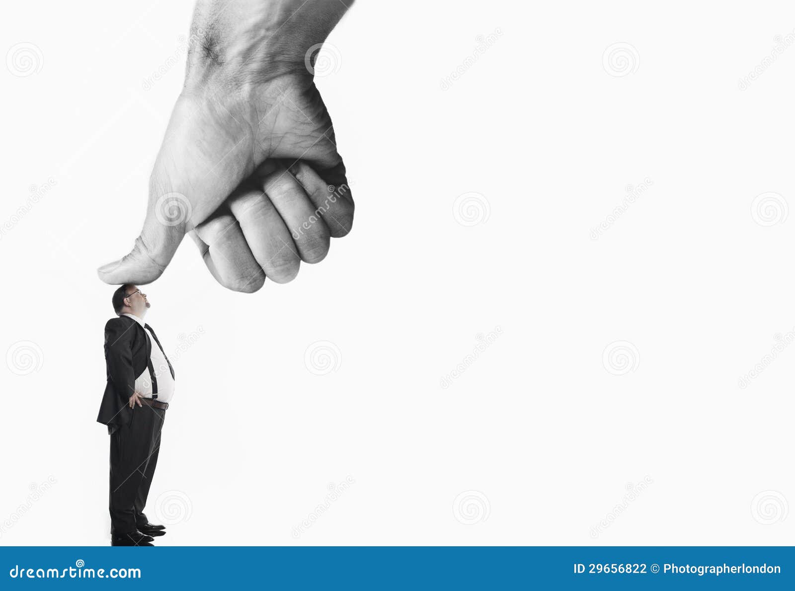 Executive Being Pushed by Large Thumb Stock Photo - Image of ...