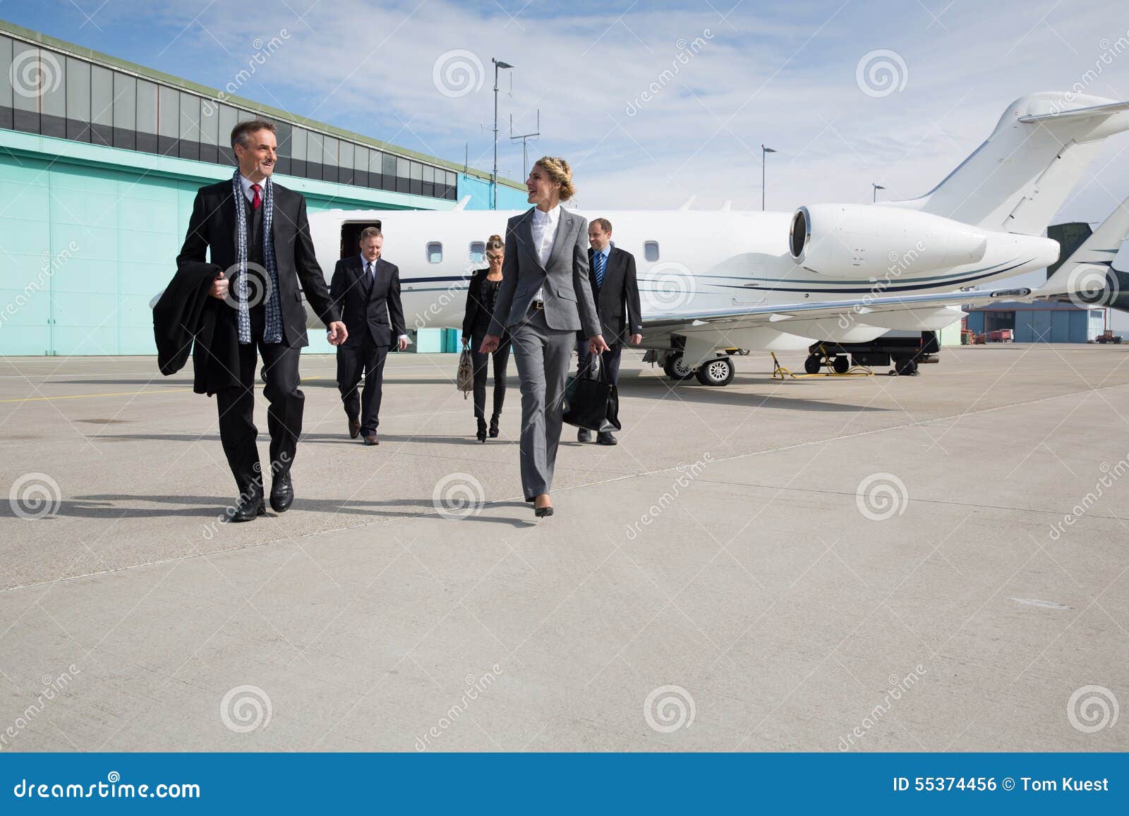 Executive Business Team Leaving Corporate Jet Stock Photo - Image of ...