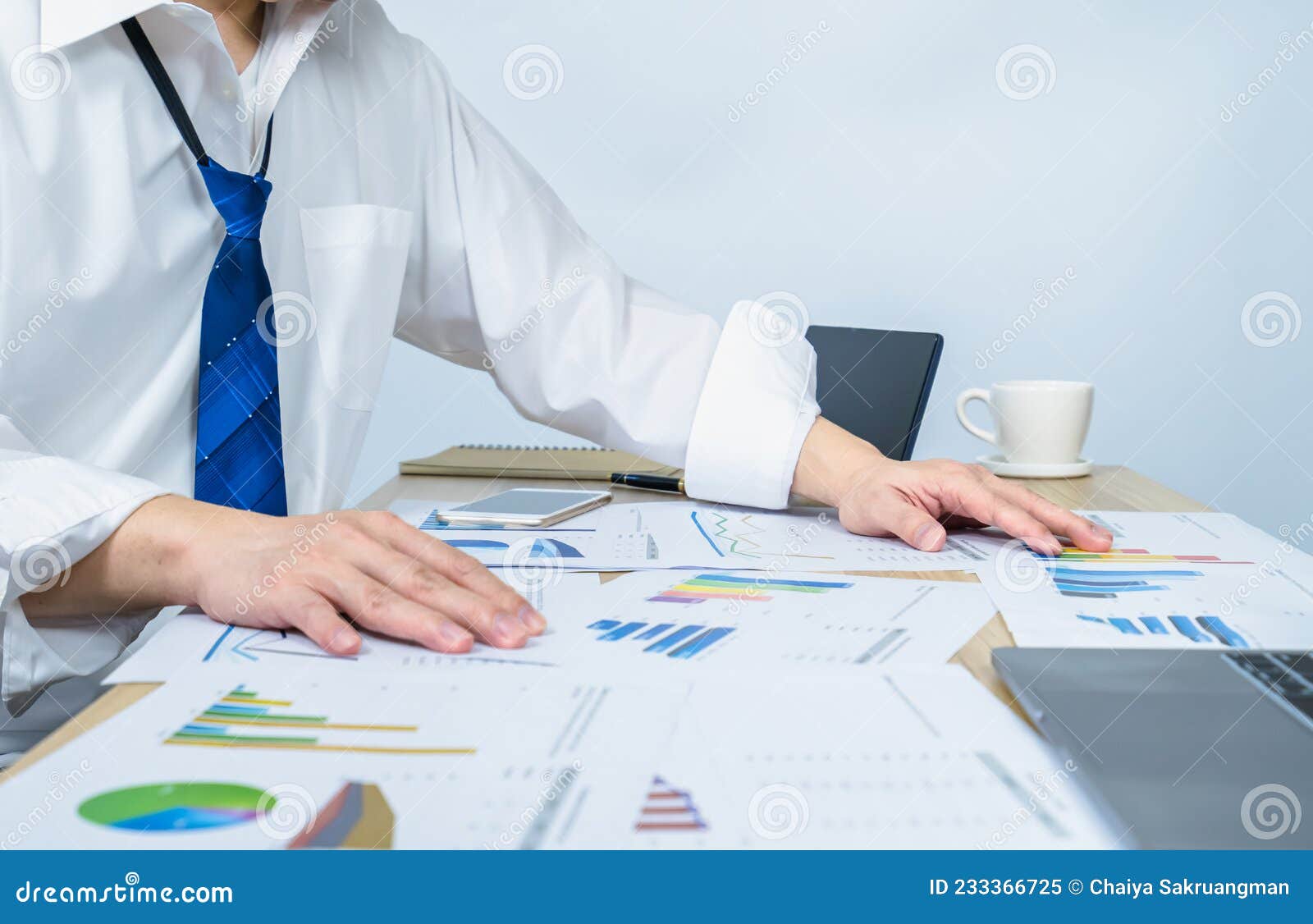 Executive Busy Working with Varieties of Document Graph on Working Desk ...