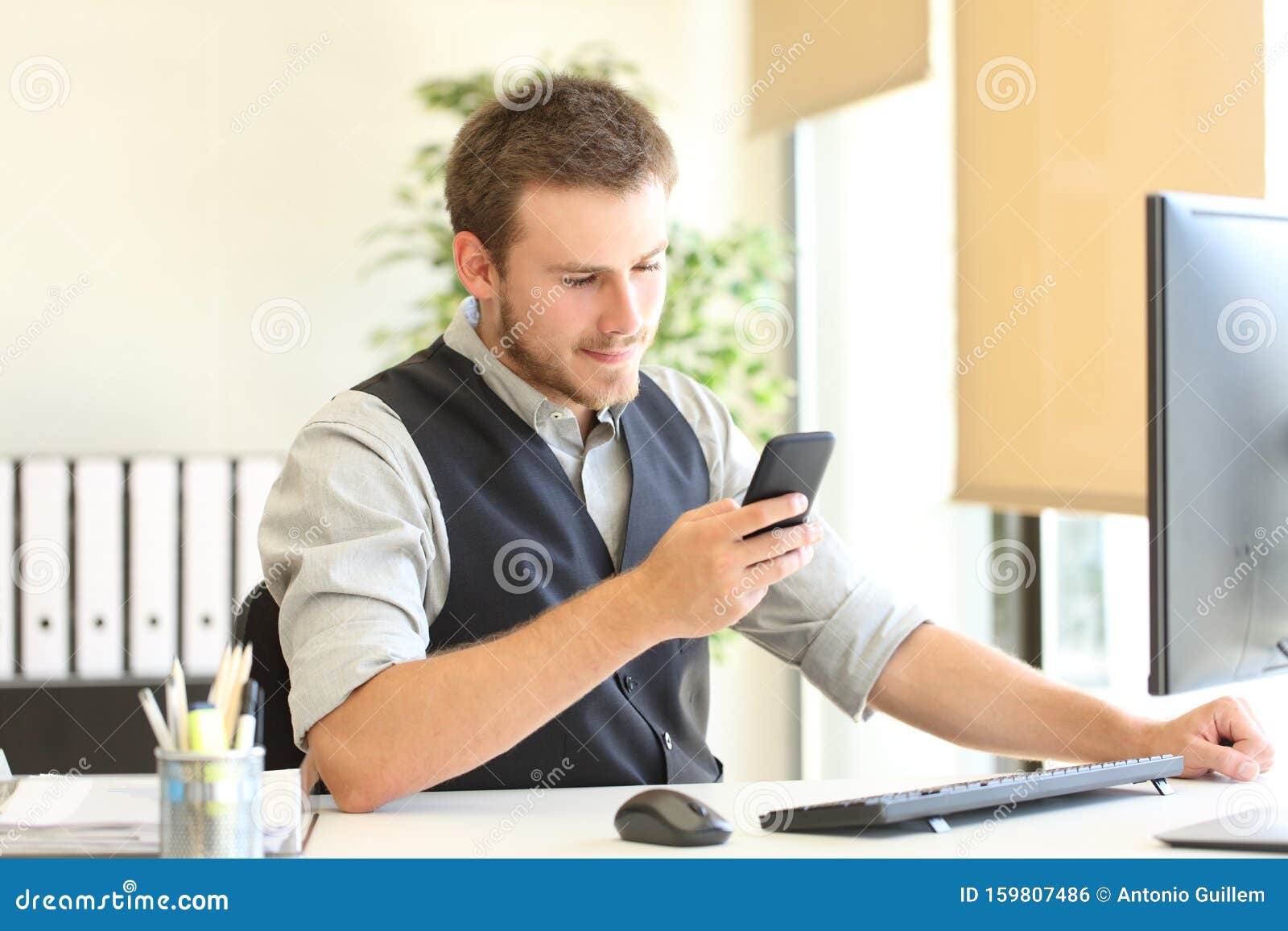 Executive Checking Smart Phone Message at Office Stock Photo - Image of ...