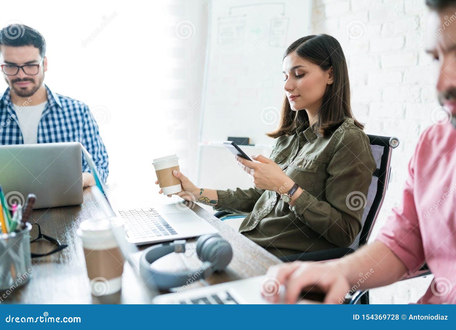 Executive Checking Smartphone at Workplace Stock Photo - Image of ...