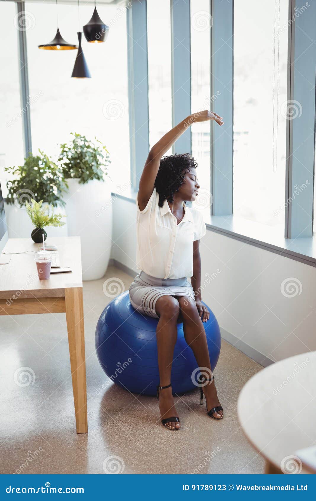 Executive Performing Stretching Exercise on Fitness Ball Stock Image ...