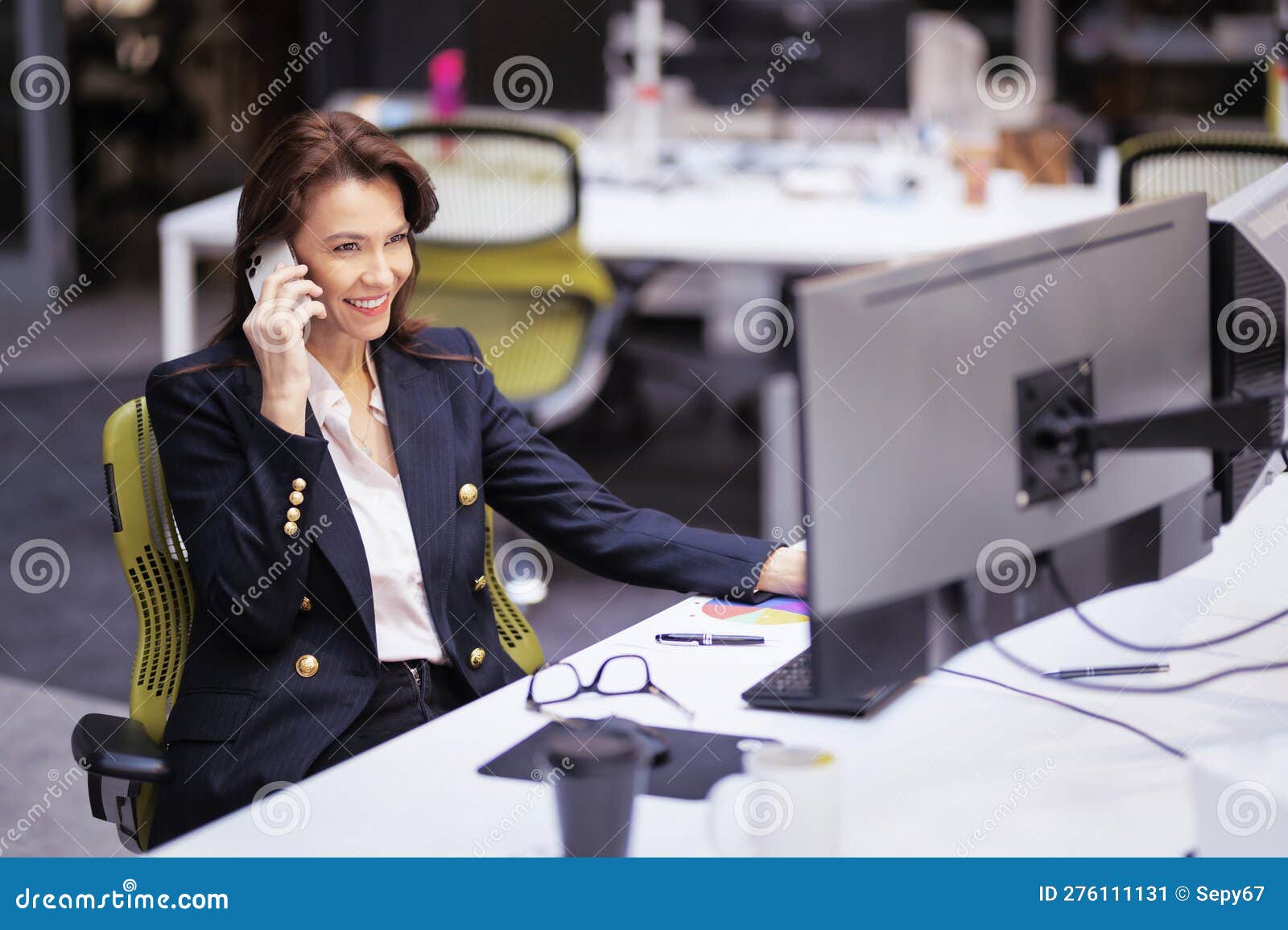 Executive Professional Woman Sitting at Desk Surrounded by Computers ...