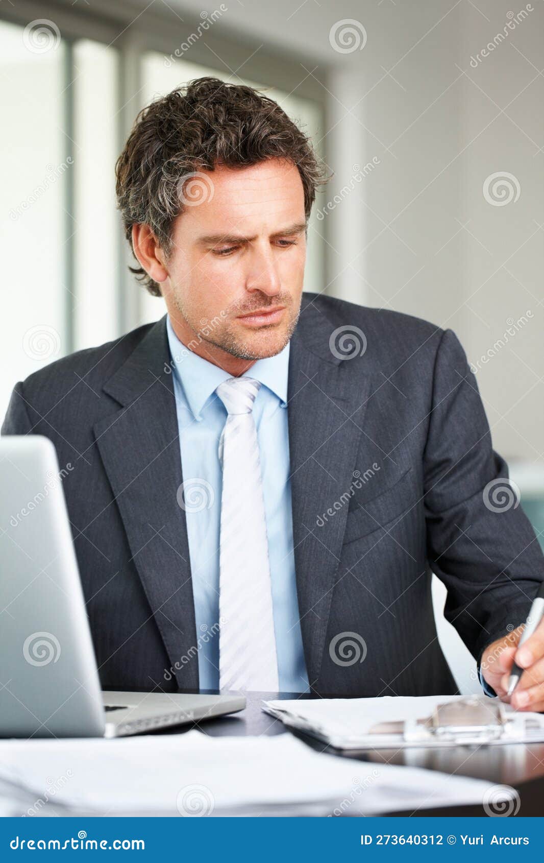 Executive Taking Notes. Middle Aged Business Man Working on Laptop and ...