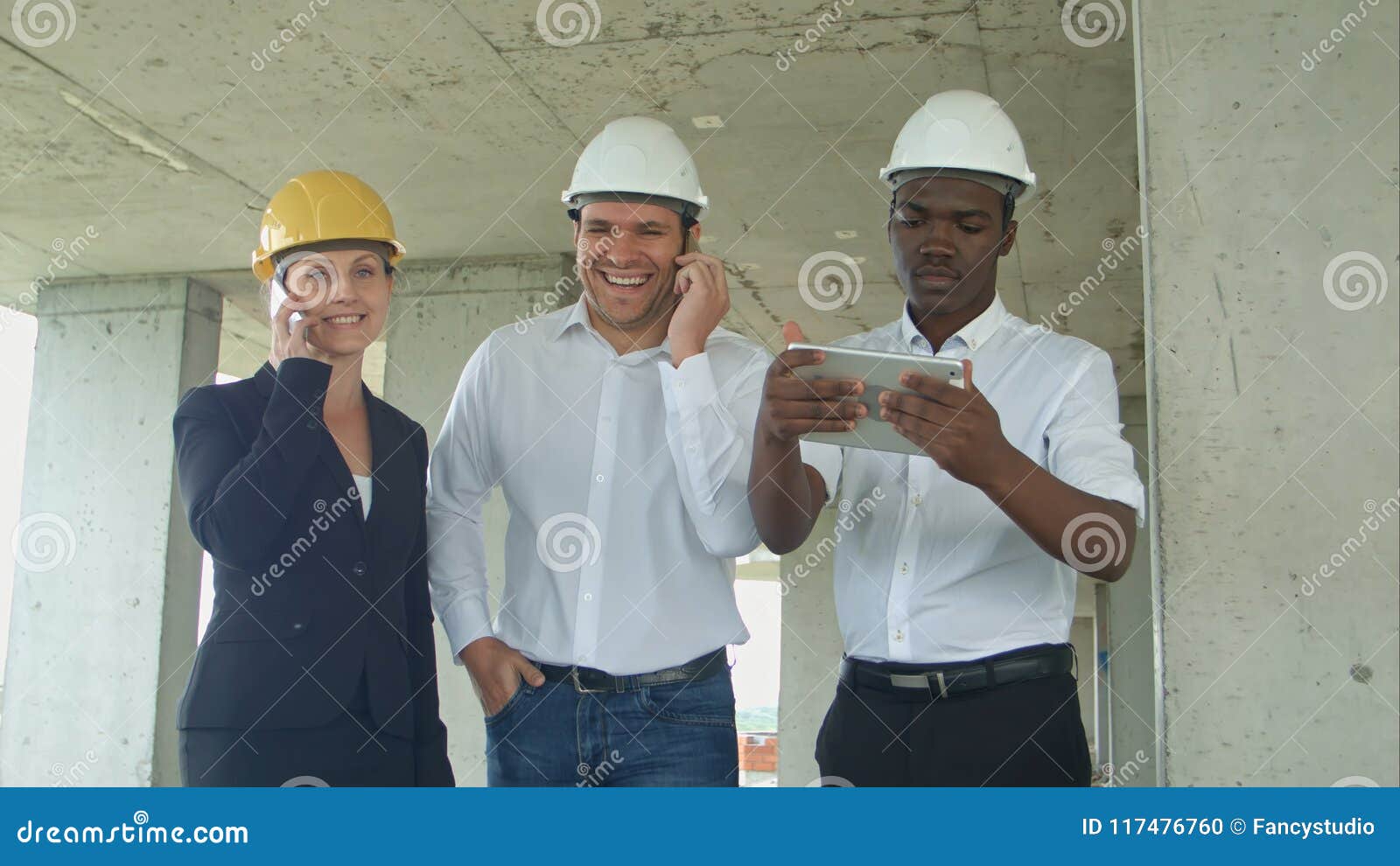 Executive Team on Construction Site Discussing Project, Using Tablet ...
