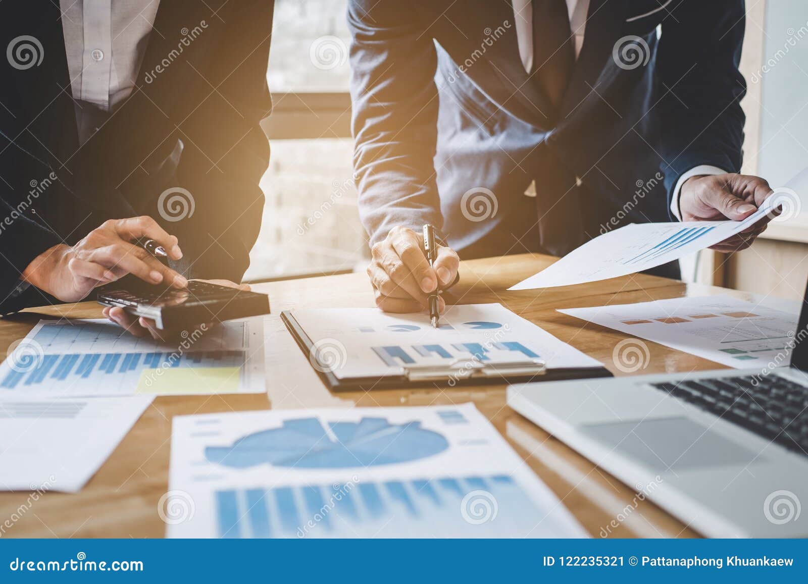 Executive Team Discussing the Charts and Graphs Working in Business ...