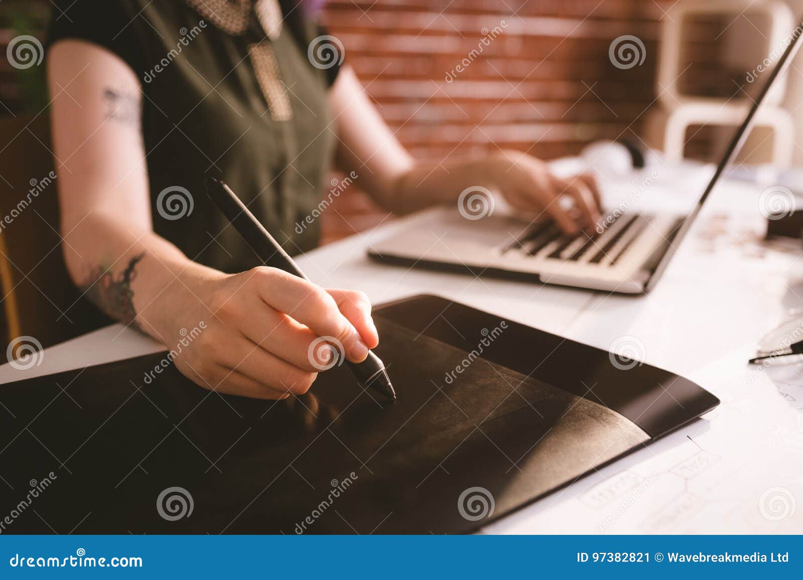 Executive Working on Stylus while Using Laptop in Office Stock Image ...