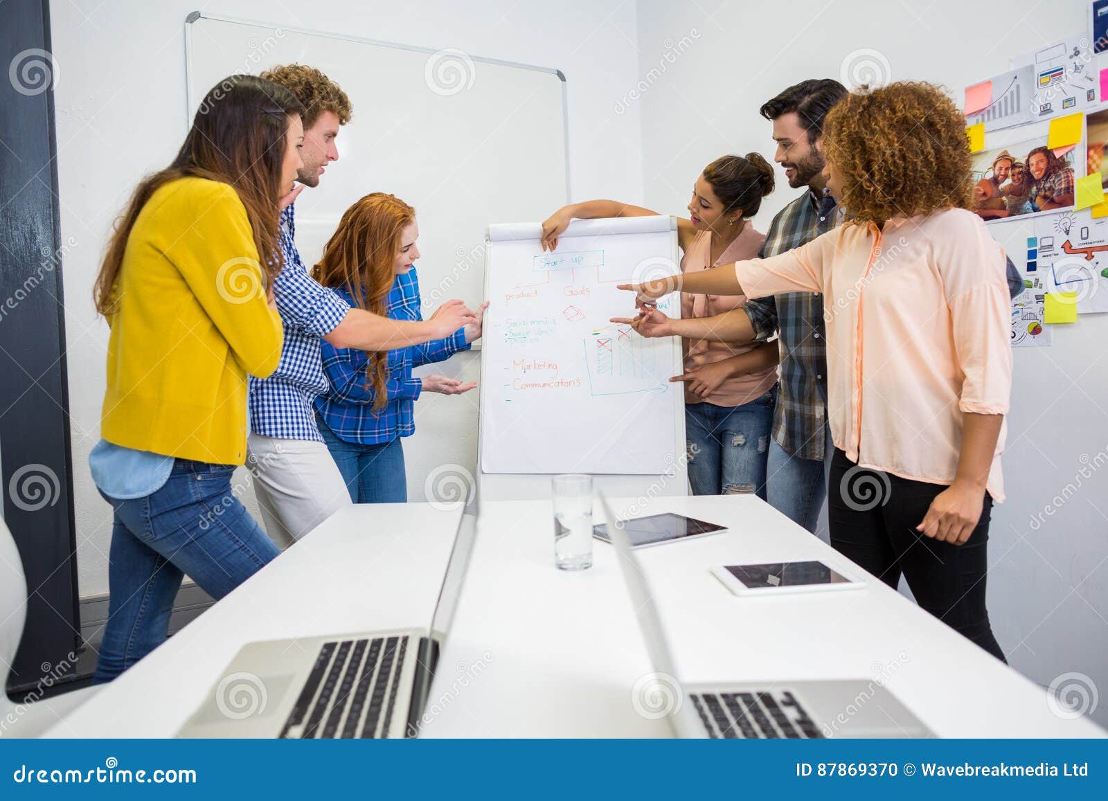 Executives Discussing Over Flip Chart Board in Conference Room Meeting ...
