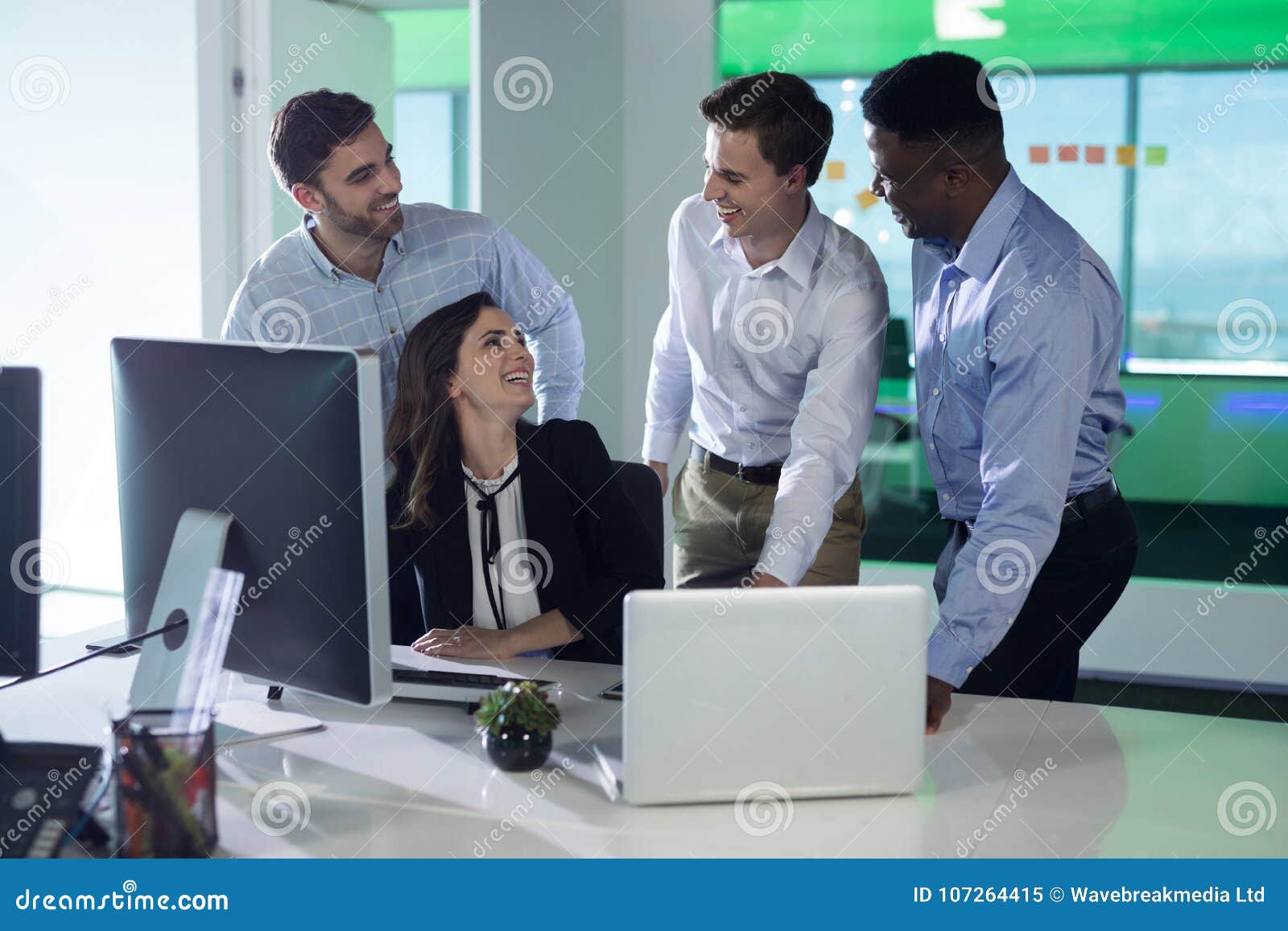 Executives Interacting while Working on Personal Computer Stock Image ...