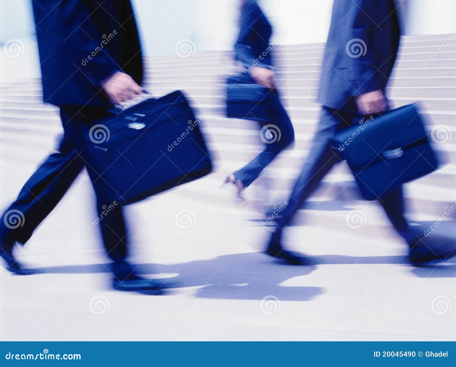 Executives moving quickly stock photo. Image of competitive - 20045490