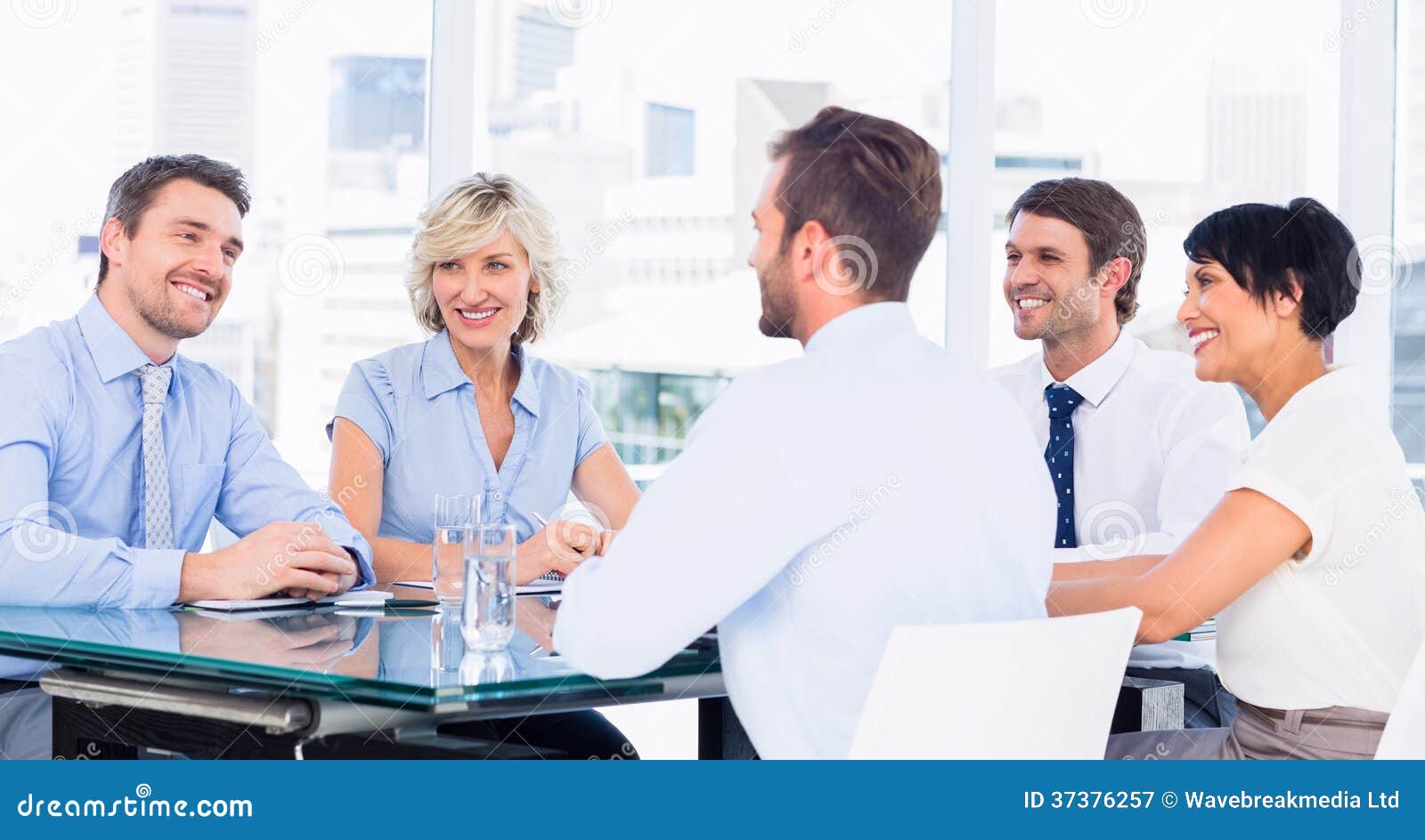 Executives Sitting Around Conference Table Stock Image - Image of woman ...