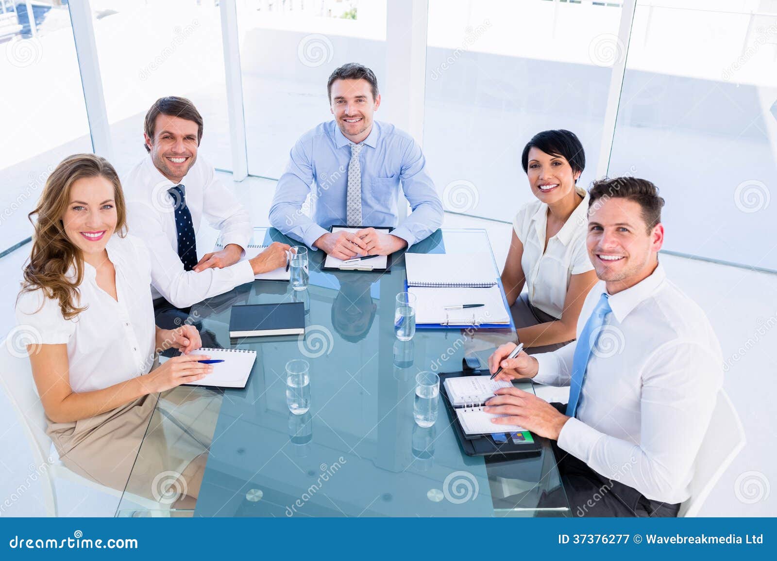 Executives Sitting Around Conference Table Stock Image - Image of ...