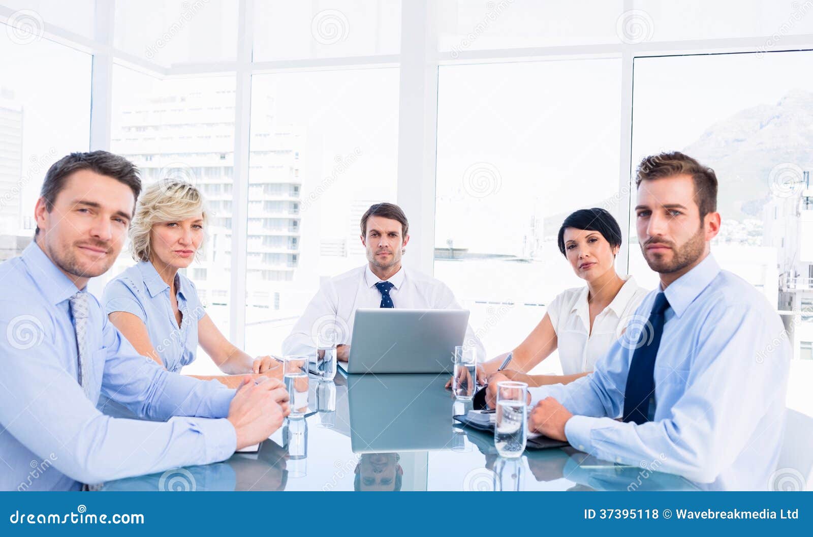 Executives Sitting Around Conference Table Stock Photo - Image of ...