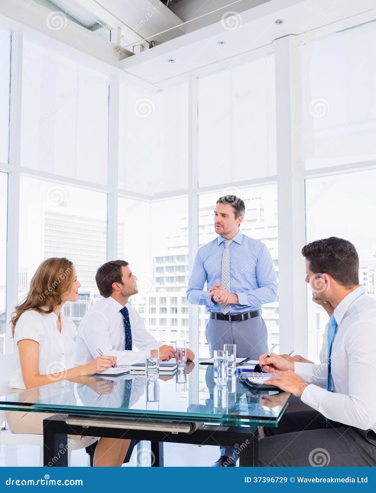 Executives Sitting Around Conference Table Stock Image - Image of ...