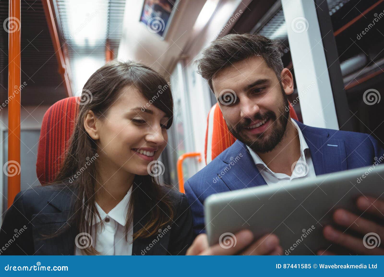 Executives Using Digital Tablet Travelling in Train Stock Image - Image ...