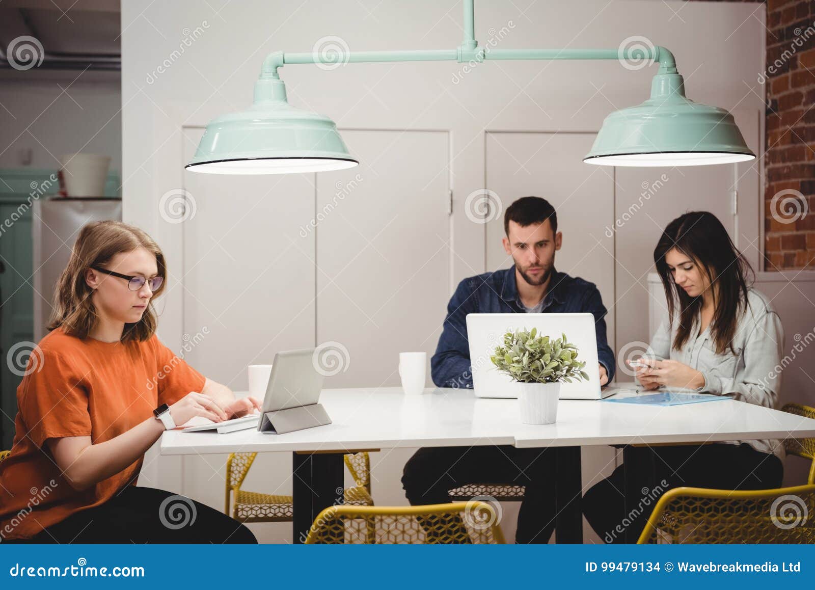 Executives working at desk stock photo. Image of digital - 99479134