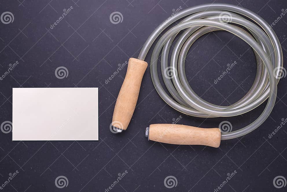 Exercise Concept : Top View Skipping Rope on Black Stone Table. Stock ...
