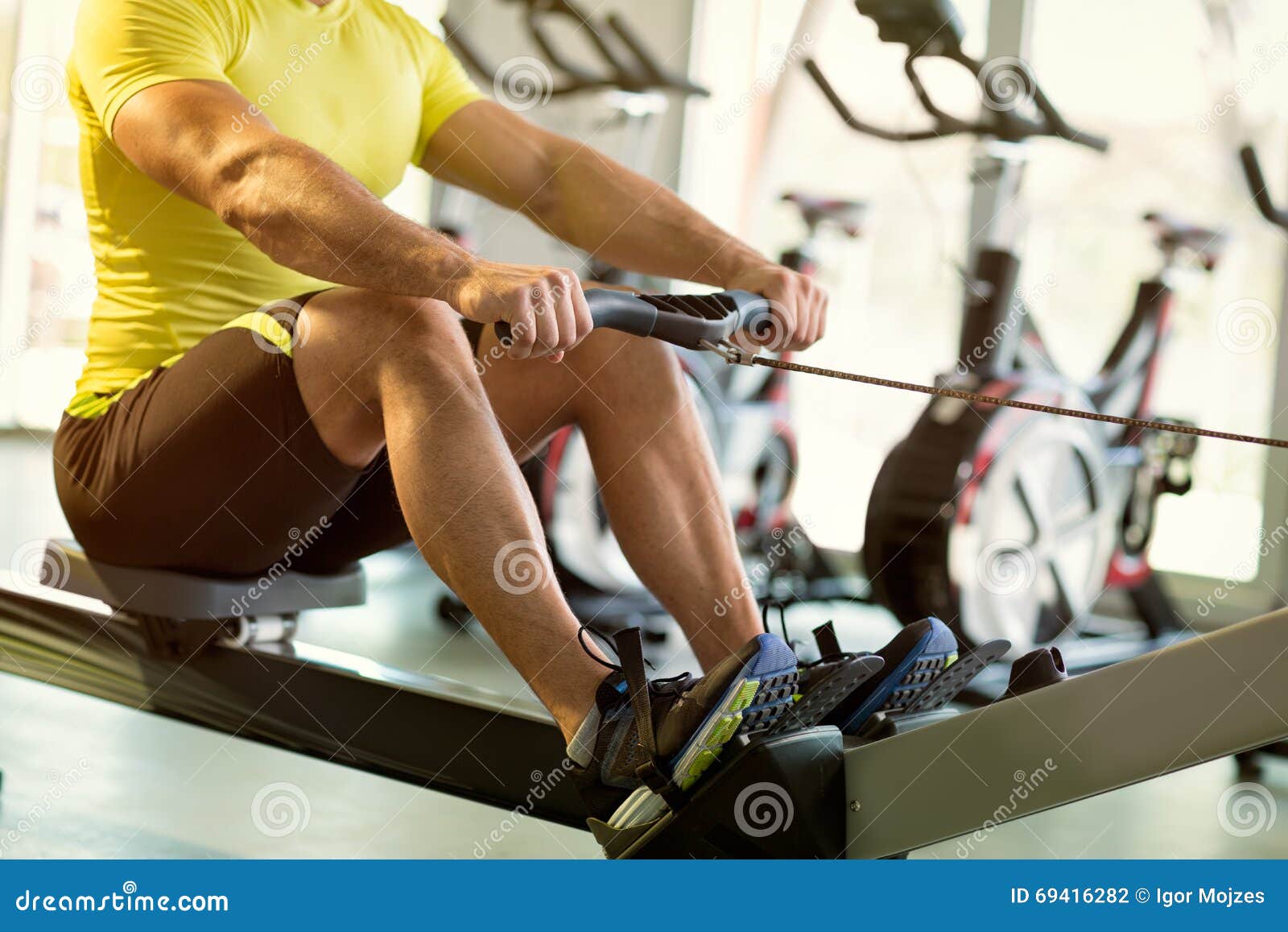 Exercise on row machine stock photo. Image of leisure - 69416282