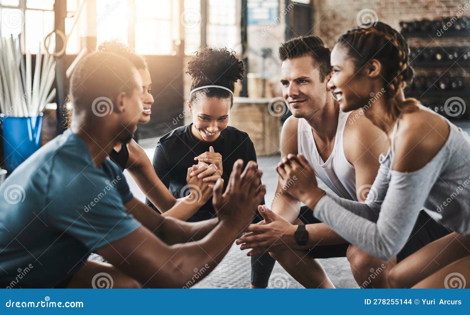 An Exercise Staple, the Classic Squat. a Group of Young People Doing ...