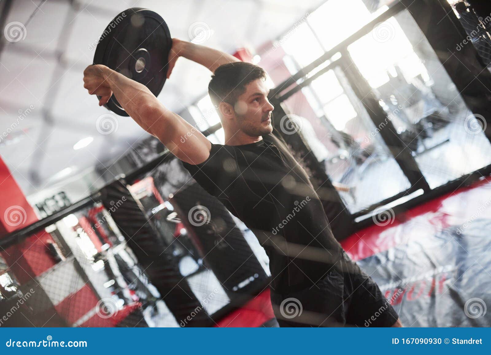 Exercise for the Strength of Separate Muscles. Man Has Workout in the ...
