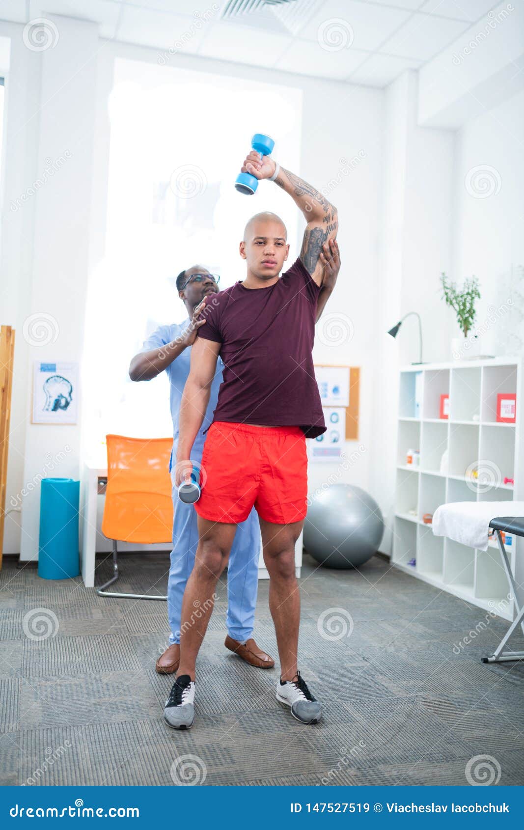 Bodybuilder Visiting Therapist Doing Exercises with Barbells Stock ...