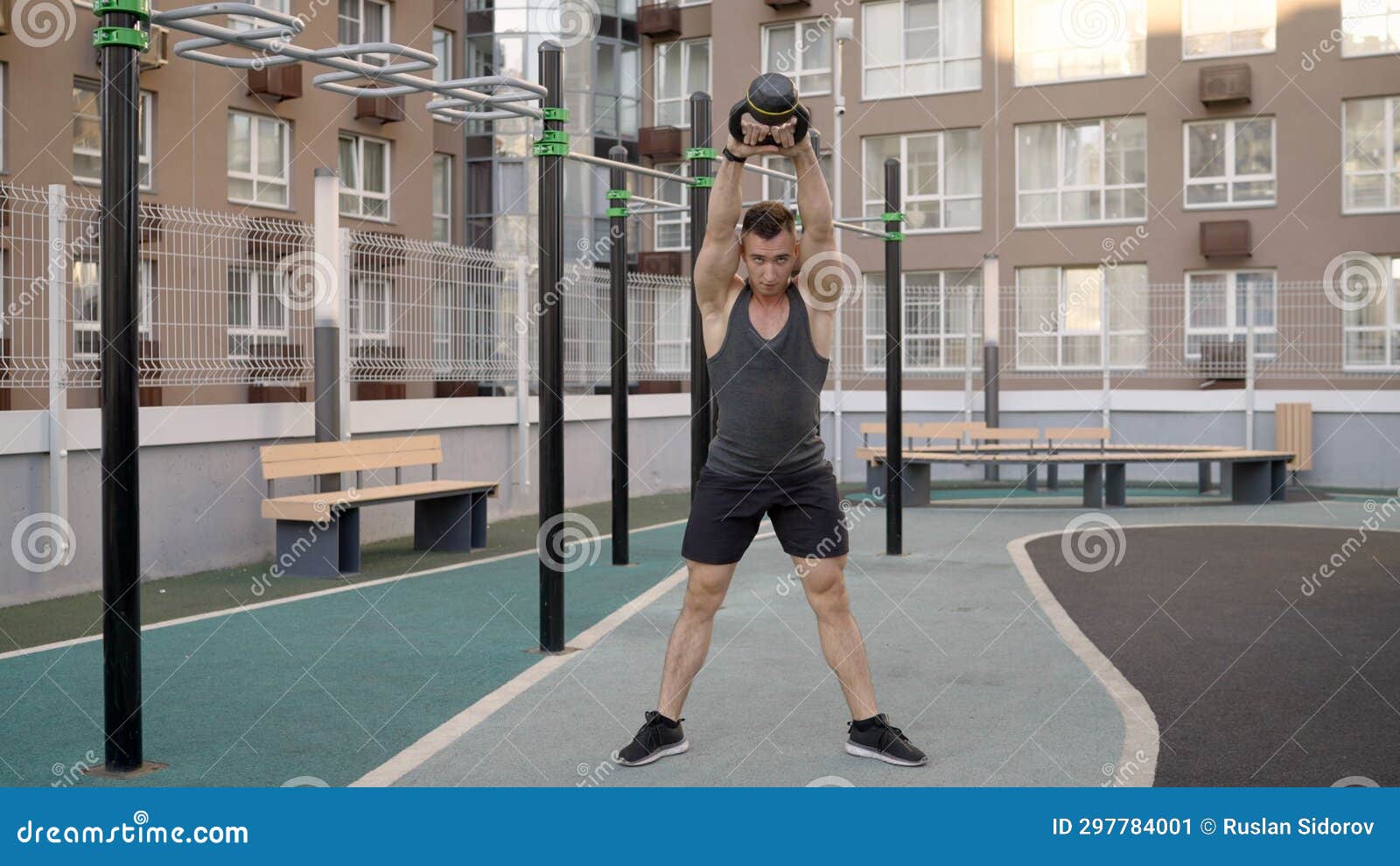Exercises with a Kettlebell 12 Kilograms. Front View of a Strong Guy ...