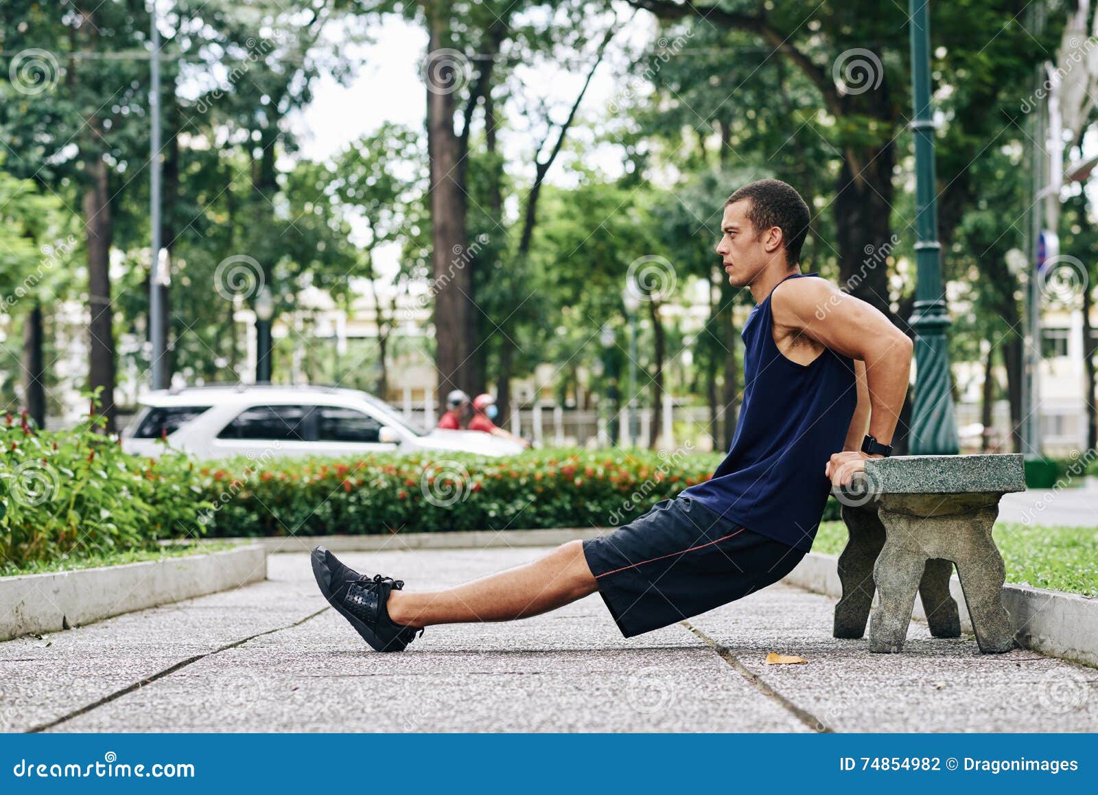 Exercising at bench stock photo. Image of exercise, park - 74854982
