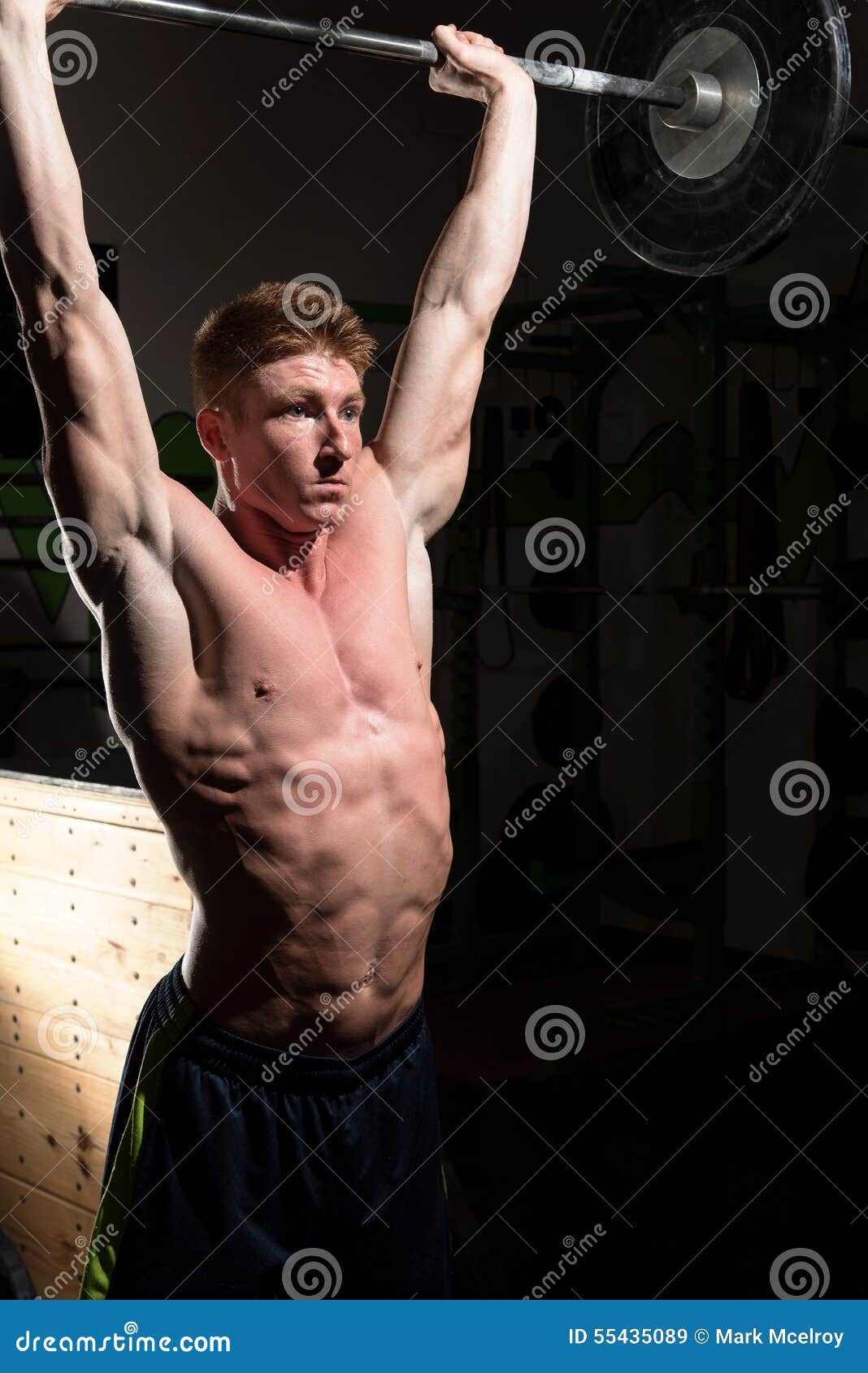 Exercising in Dramatic Light Stock Image - Image of lighting, defined ...