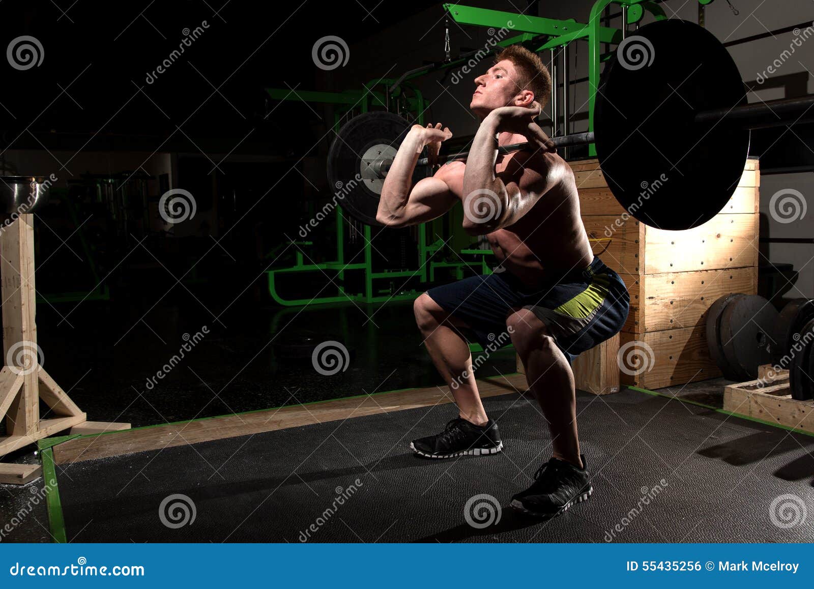Exercising in Dramatic Light Stock Photo - Image of lifting, personal ...