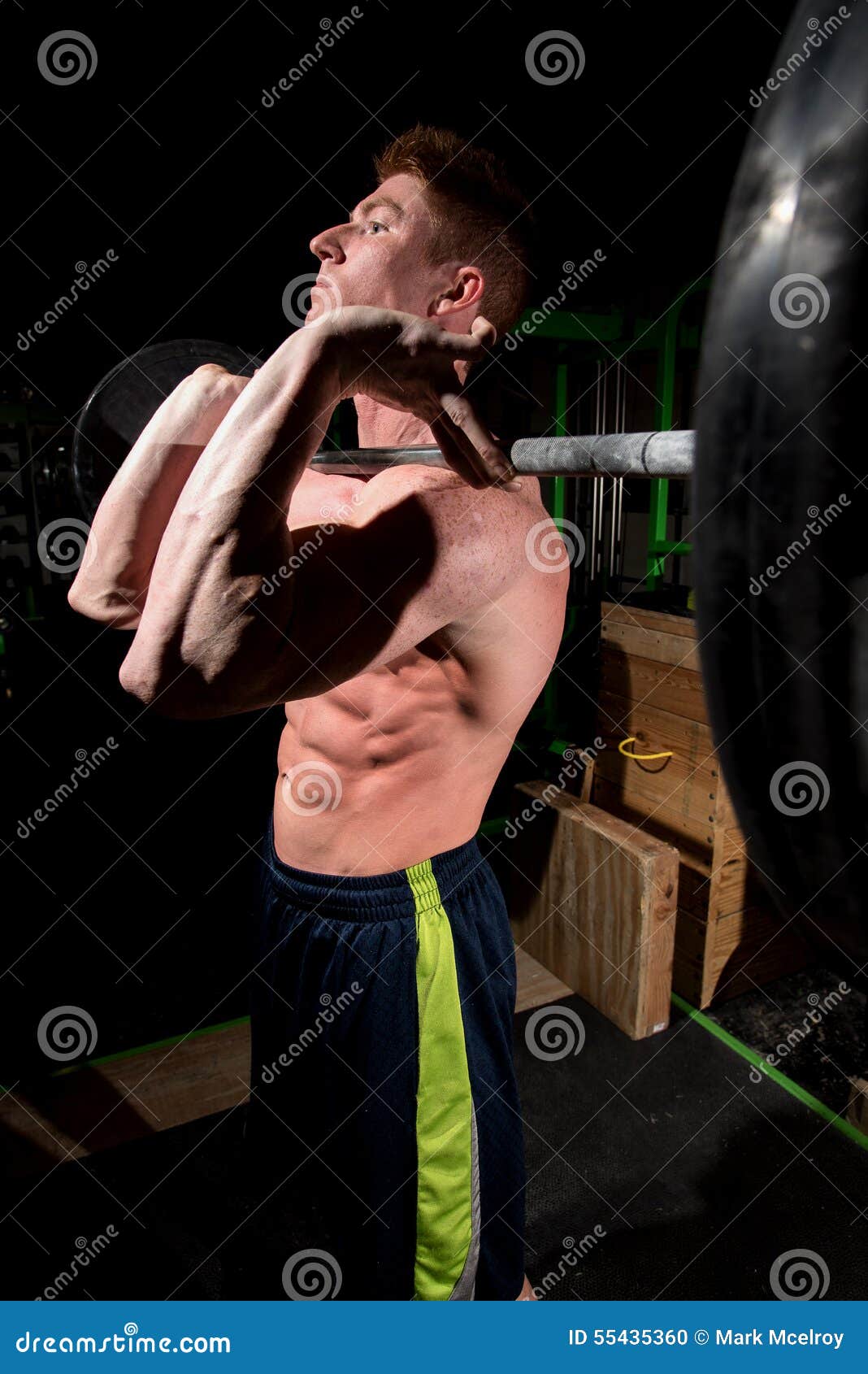 Exercising in Dramatic Light Stock Photo - Image of attractive, hard ...