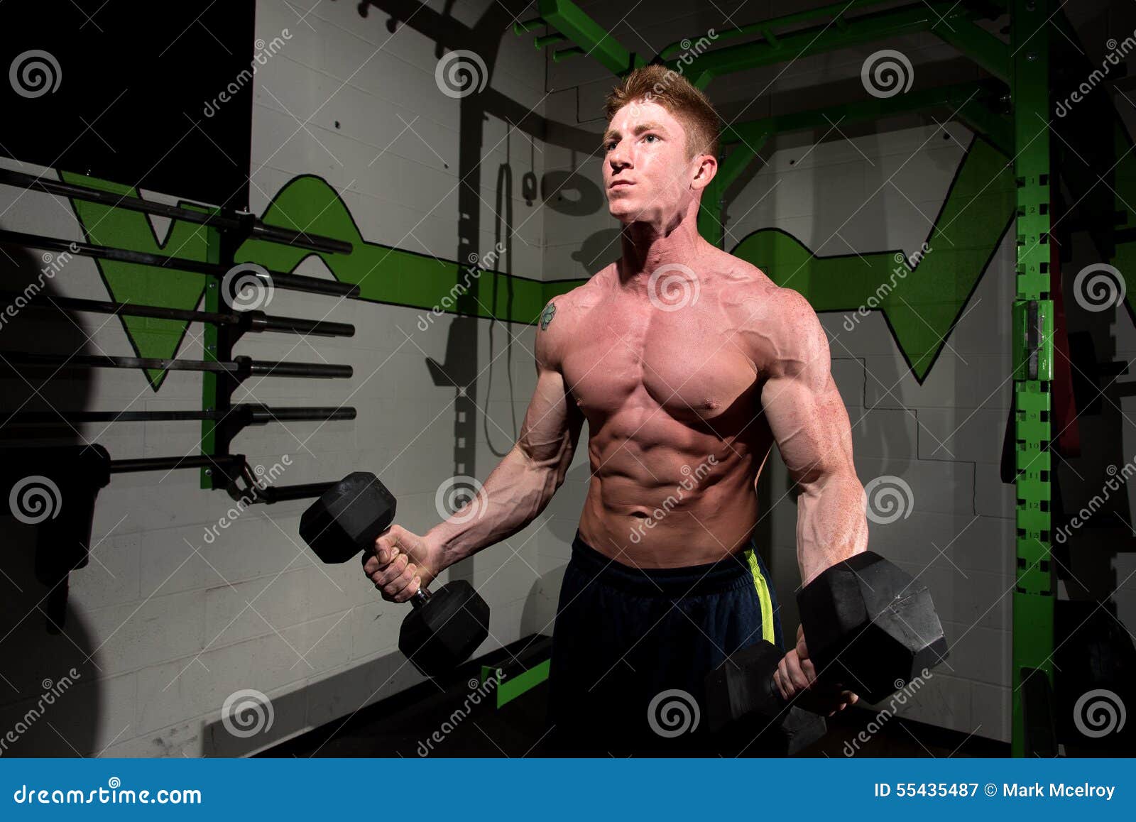 Exercising in Dramatic Light Stock Image - Image of coach, dramatic ...