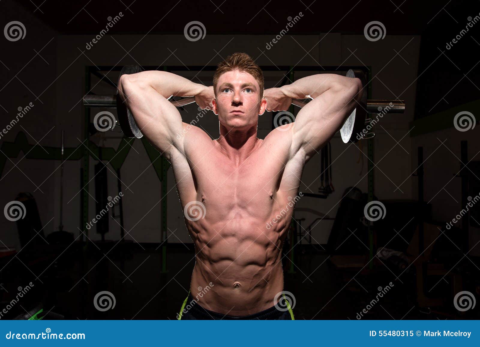 Exercising in Dramatic Light Stock Image - Image of attractive, light ...