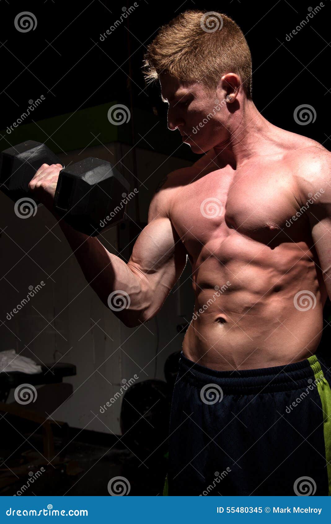 Exercising in Dramatic Light Stock Image - Image of lighting, lifting ...